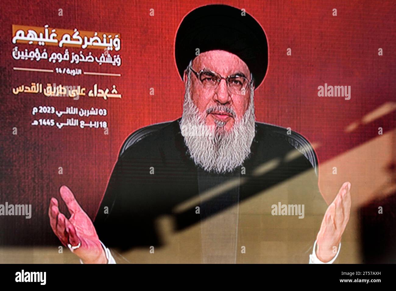 Hezbollah leader Sayyed Hassan Nasrallah greets his supporters via ...