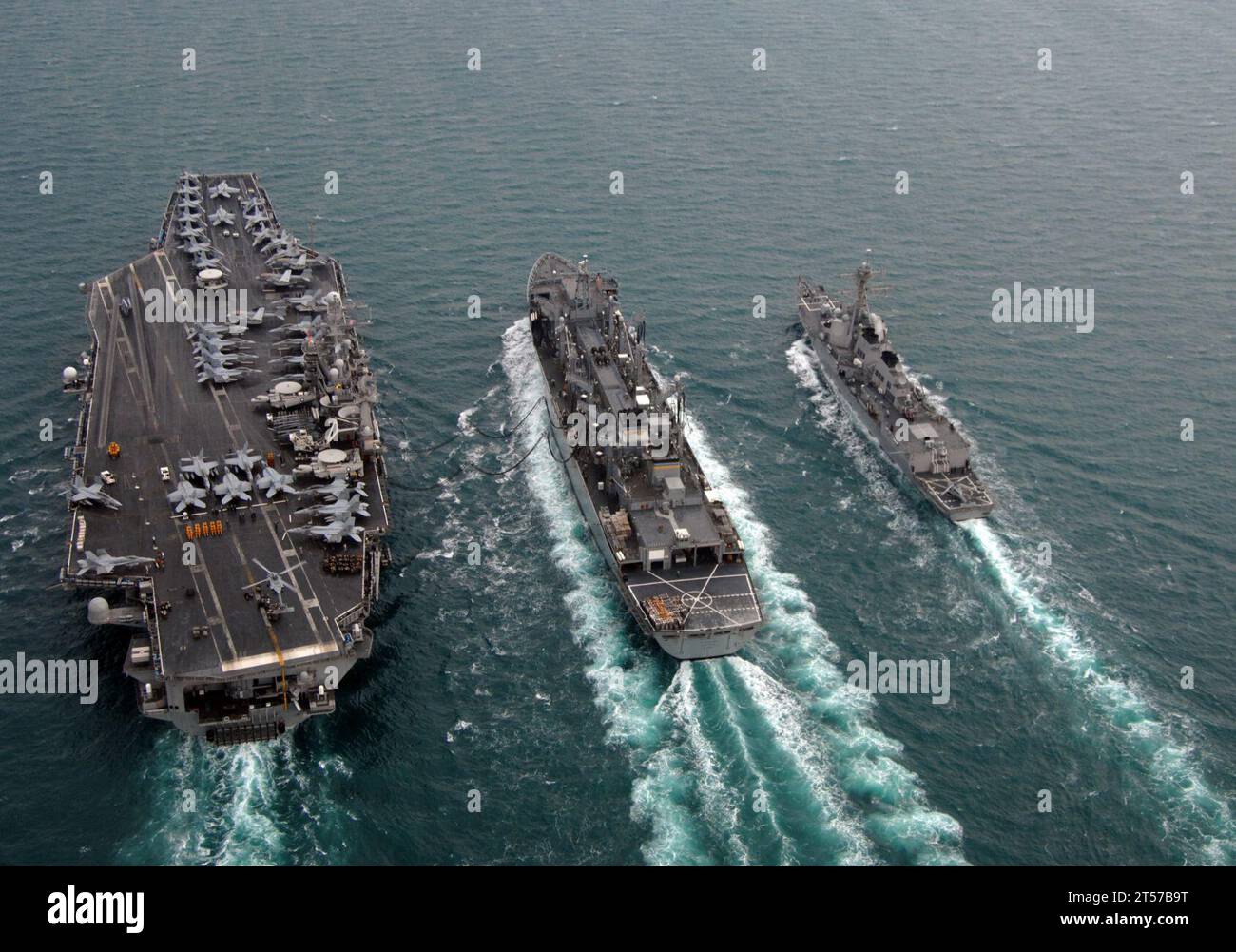 US Navy The aircraft carrier USS Harry S. Truman (CVN 75), left ...