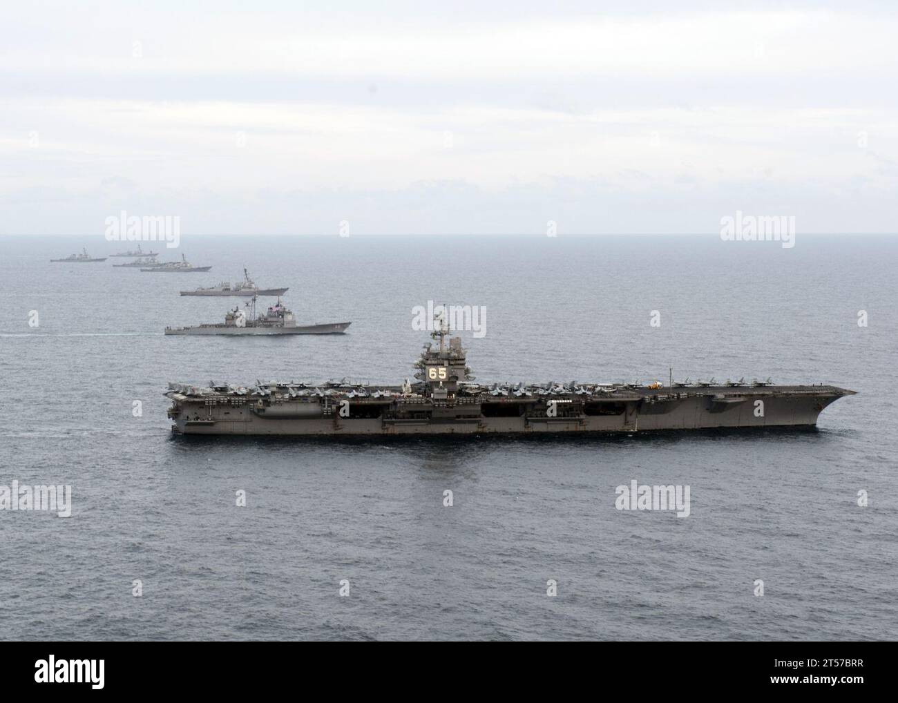US Navy The Enterprise Carrier Strike Group maneuvers into formation ...