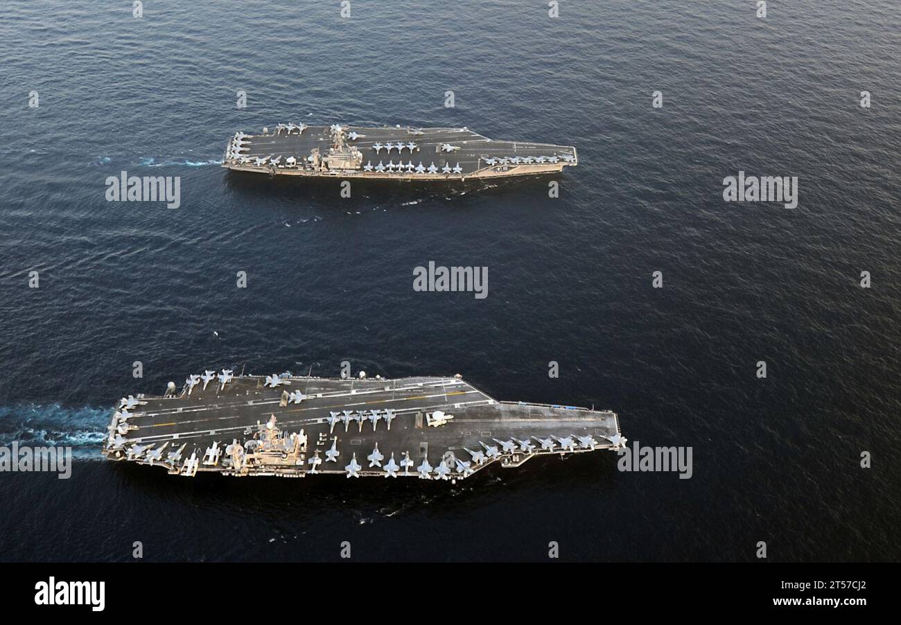 US Navy The Nimitz-class aircraft carriers USS Abraham Lincoln (CVN 72) and USS John C. Stennis ...