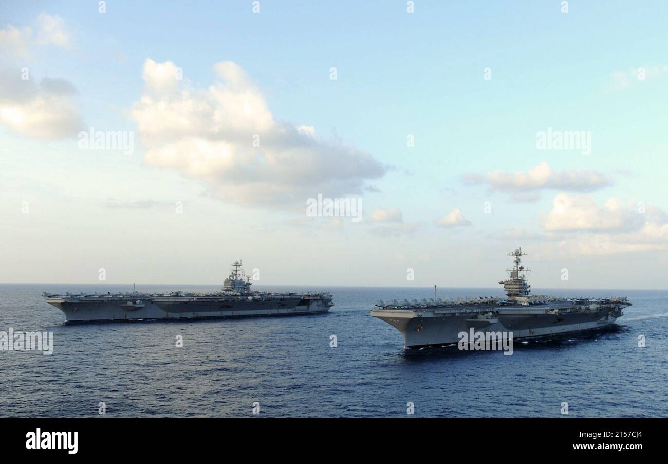 US Navy The Nimitz-class aircraft carriers USS Abraham Lincoln (CVN 72) and USS John C. Stennis ...
