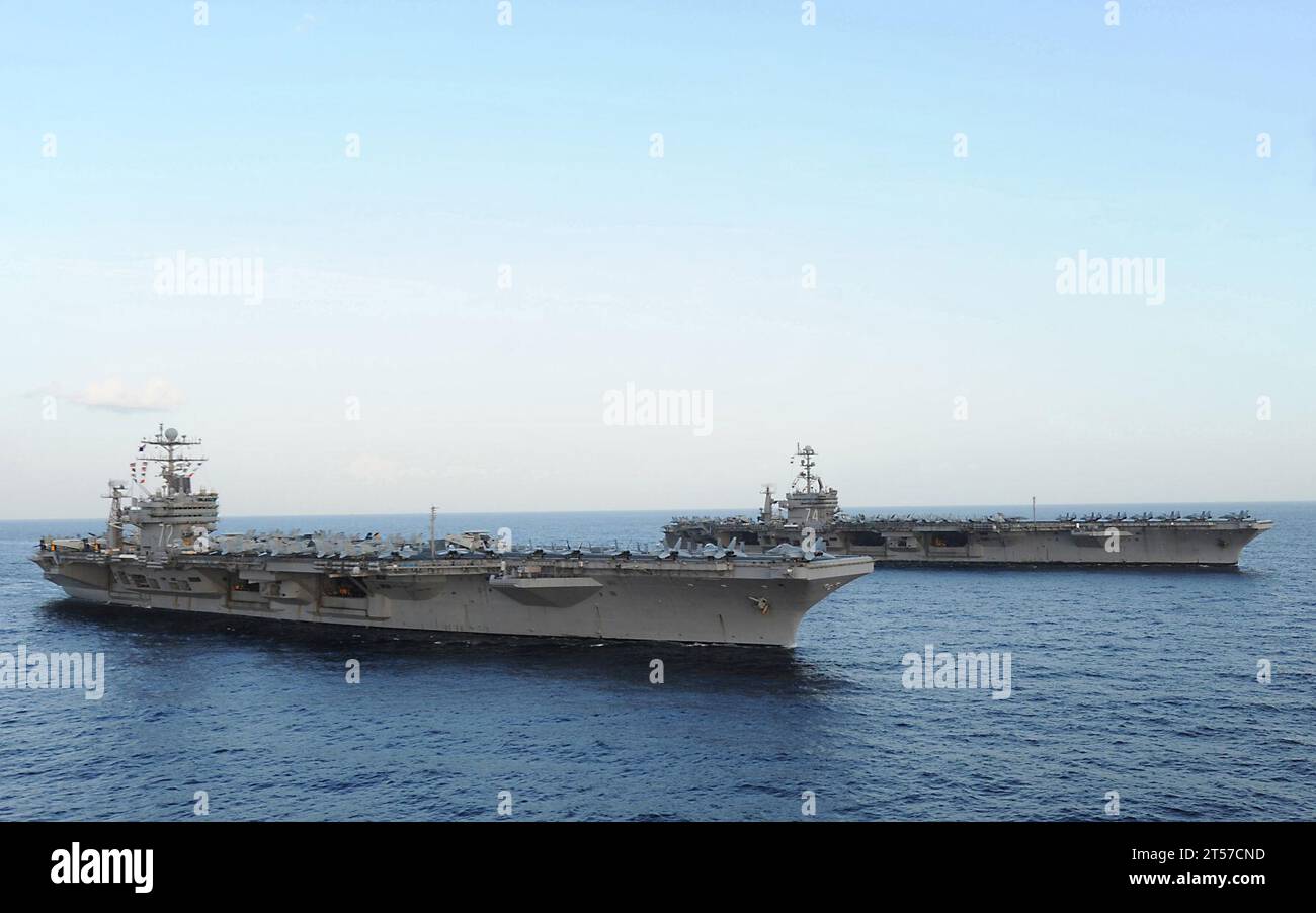 US Navy The Nimitz-class aircraft carriers USS Abraham Lincoln (CVN 72) and USS John C. Stennis ...