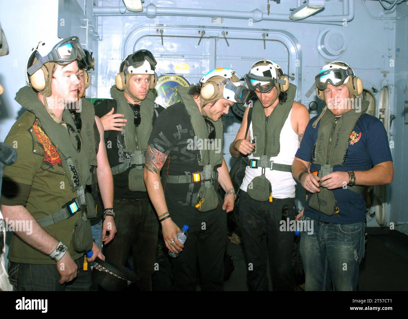 US Navy The rock band Hinder receives flight safety instructions aboard ...