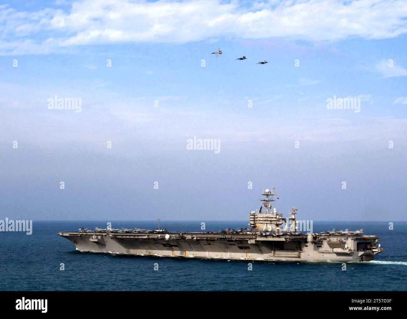US Navy Three F18 Hornets fly in formation over the Nimitz-class ...