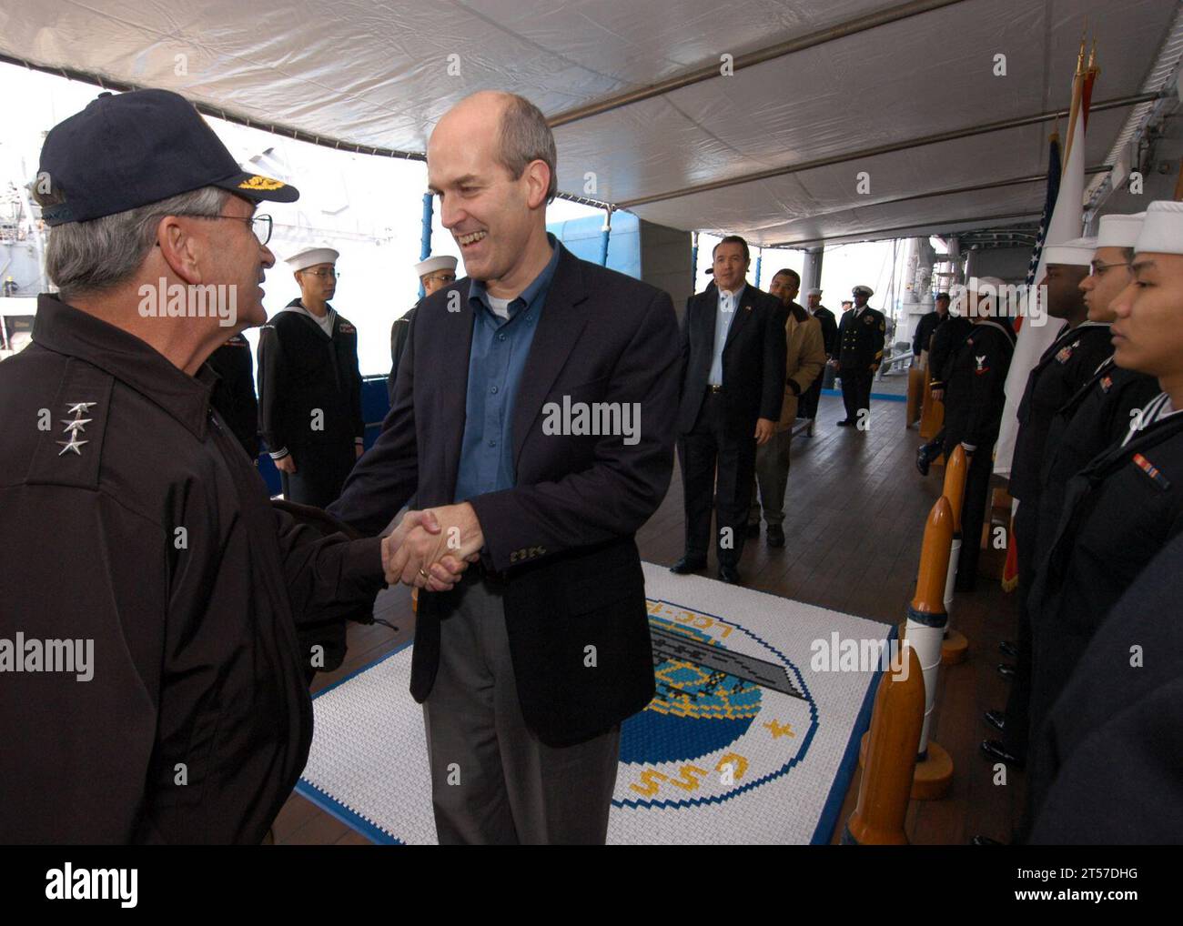 US Navy U.S. Rep. Rick Larsen, D-Wash., is greeted by Vice Adm. Doug ...