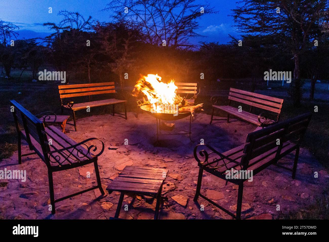 Evening bonfire in a camp near Masai Mara National Reserve, Kenya Stock ...