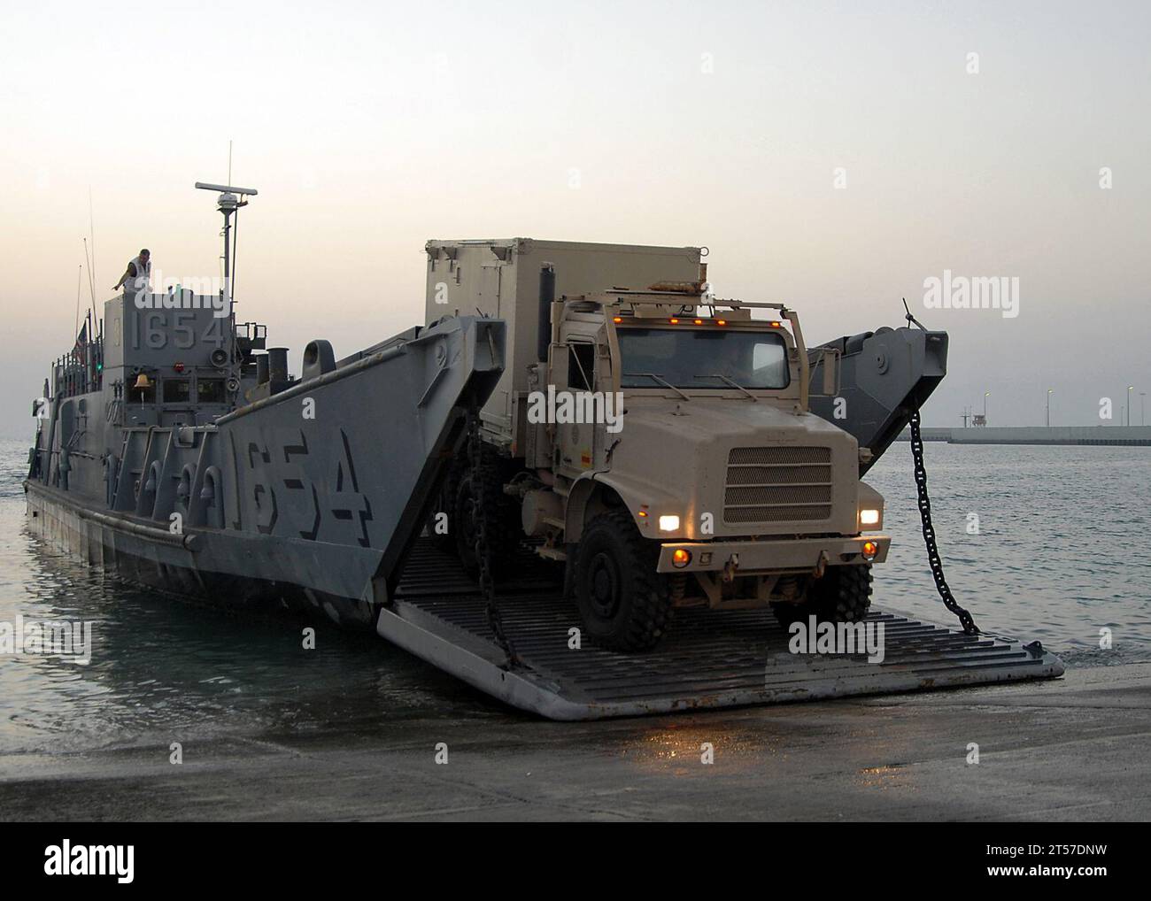 US Navy Vehicles are offloaded from a landing craft utility (LCU ...