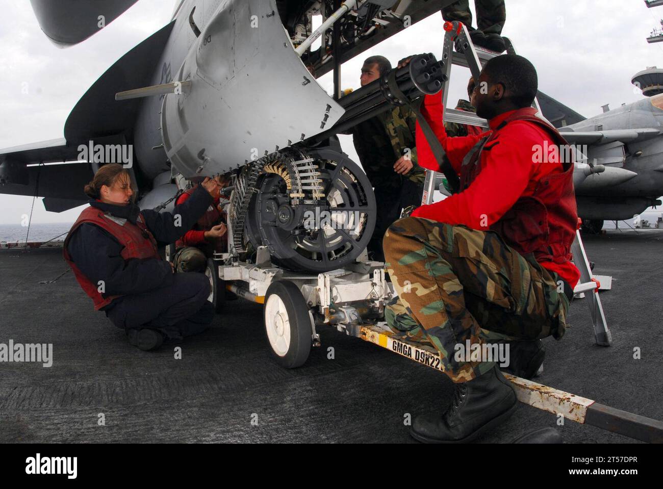 US Navy VFA-14 sailors removing M61A2 Vulcan from F18E aboard USS ...