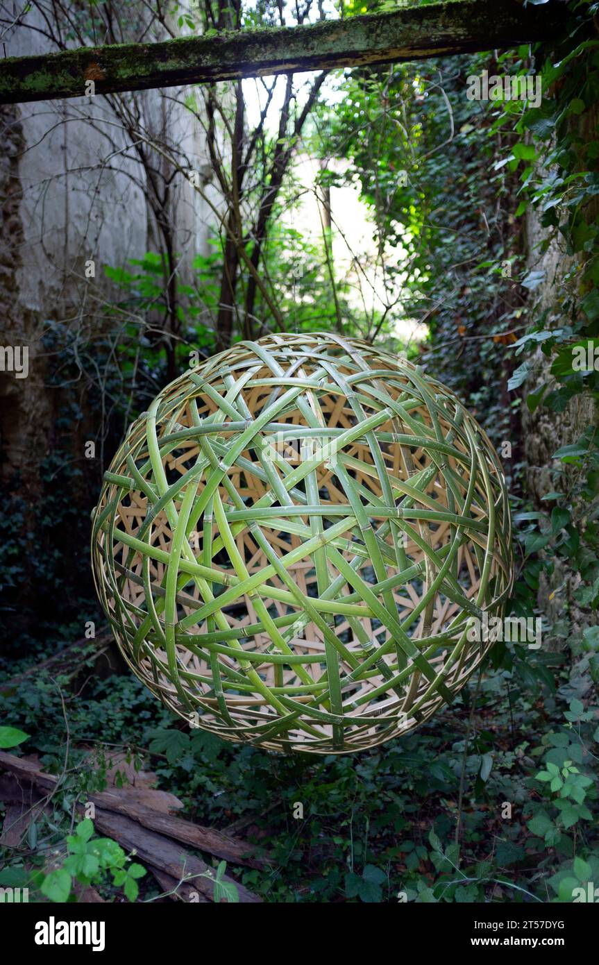 A sphere made out of bamboo hangs in the town of Saint-Macaire, France ...