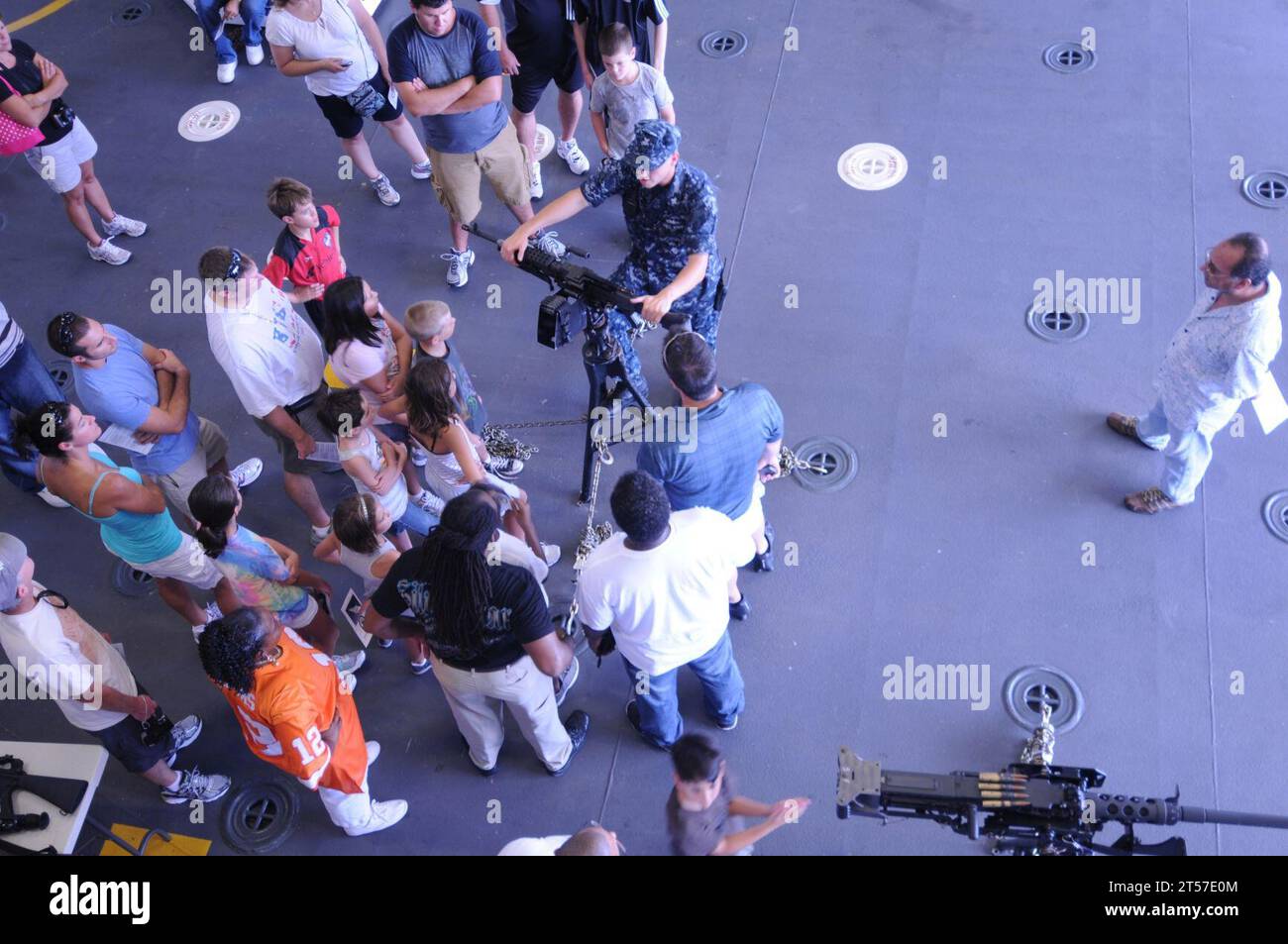 US Navy Visitors tour the helicopter hangar of the littoral combat ship ...