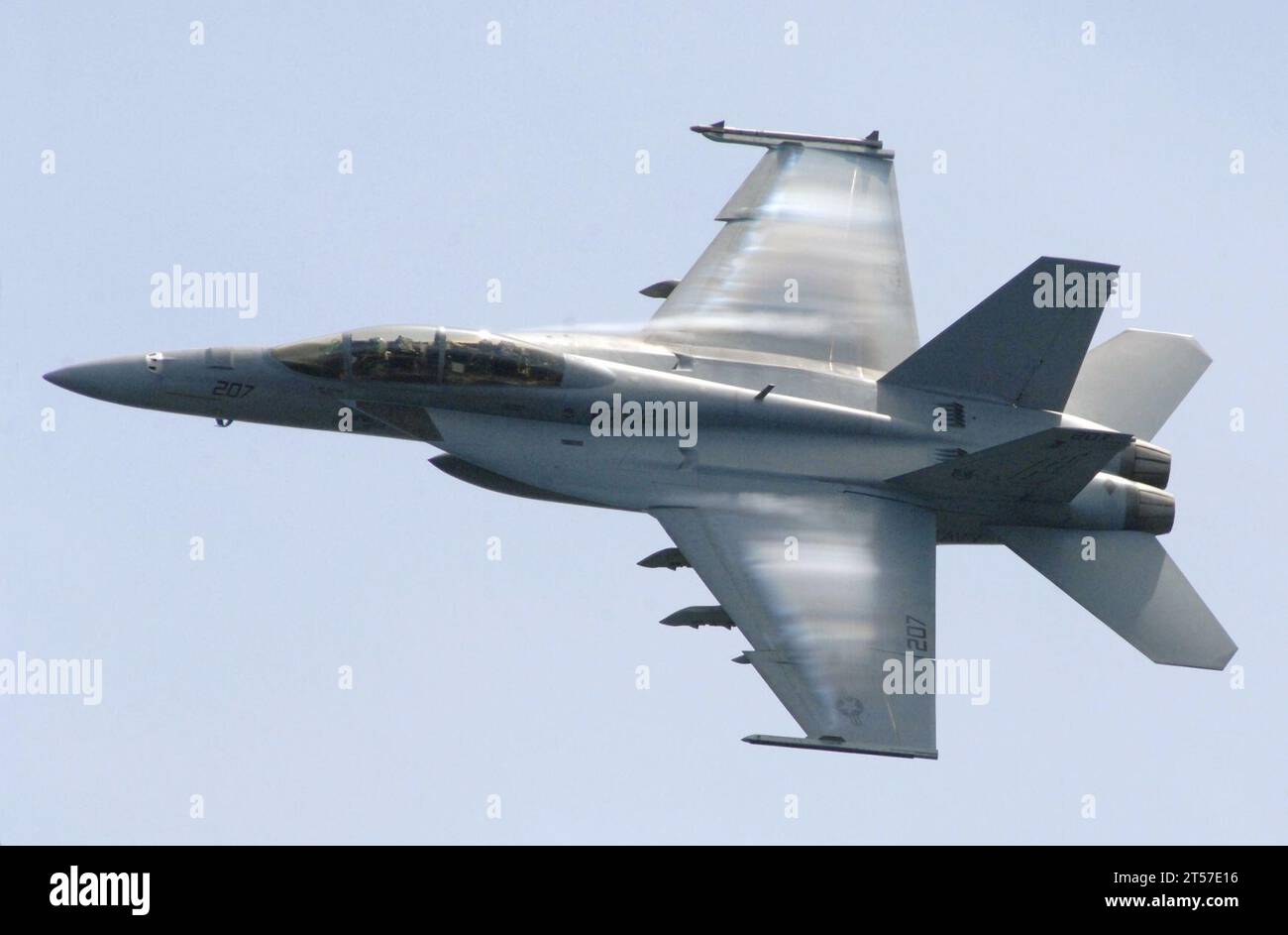 US Navy Water vapor flows over the wings of an F18F Super Hornet.jpg ...