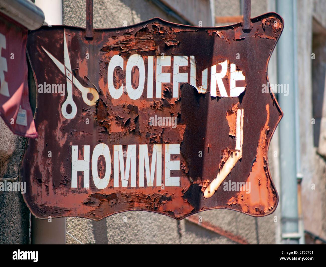 An old sign for a barbers in Saint-Chinian, France Stock Photo - Alamy