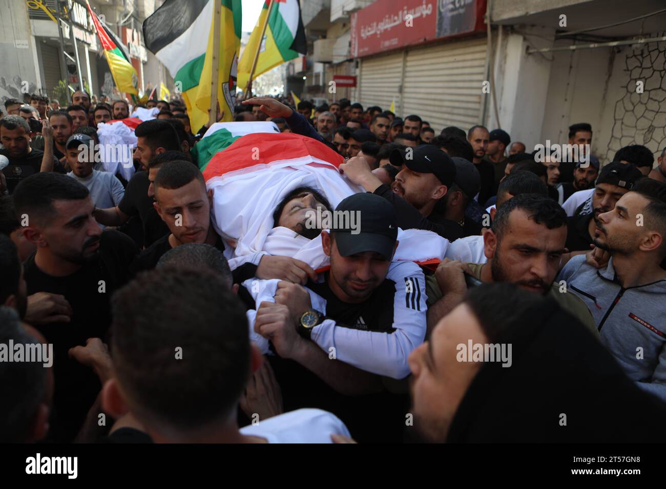Mourners carry the bodies of two Palestinians Muhammed Saaid Al-Azeh ...