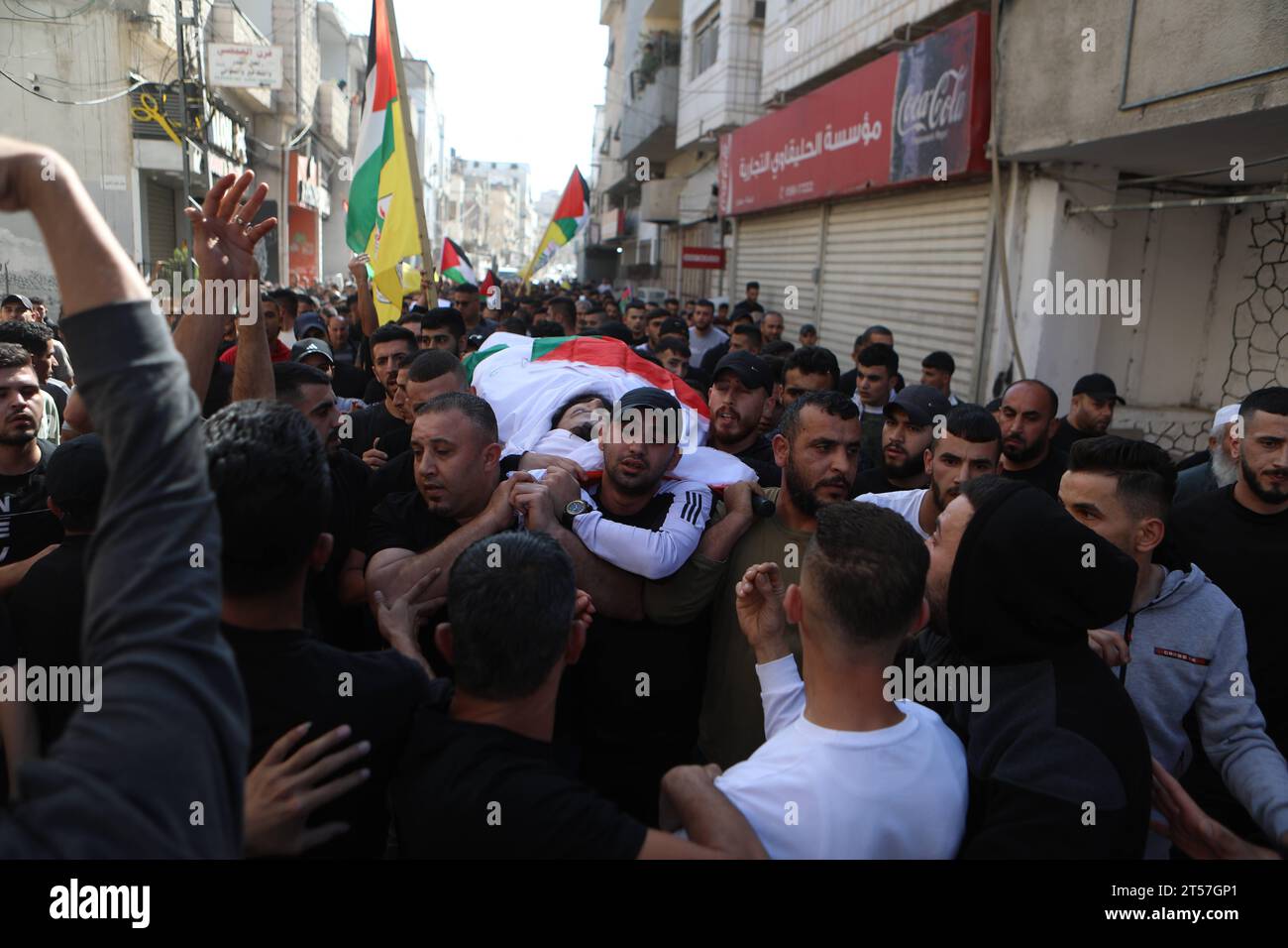 Mourners carry the bodies of two Palestinians Muhammed Saaid Al-Azeh ...