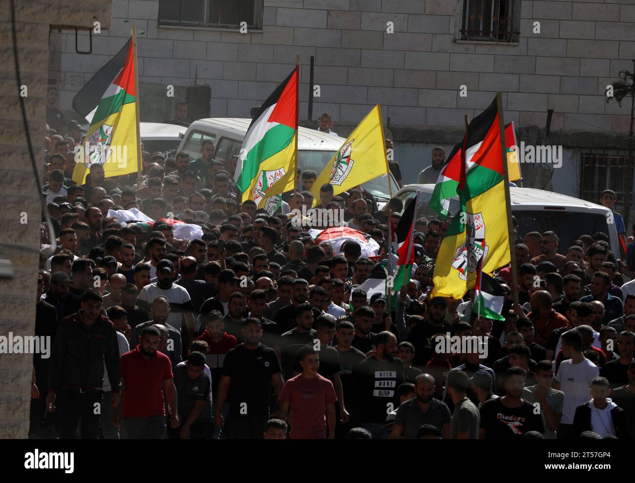 Mourners carry the bodies of two Palestinians Muhammed Saaid Al-Azeh ...
