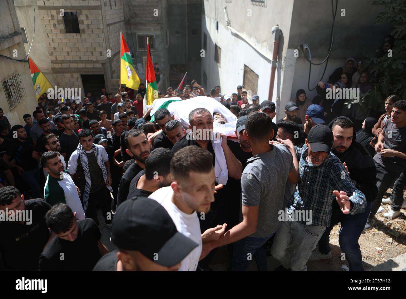 Mourners carry the bodies of two Palestinians Muhammed Saaid Al-Azeh ...
