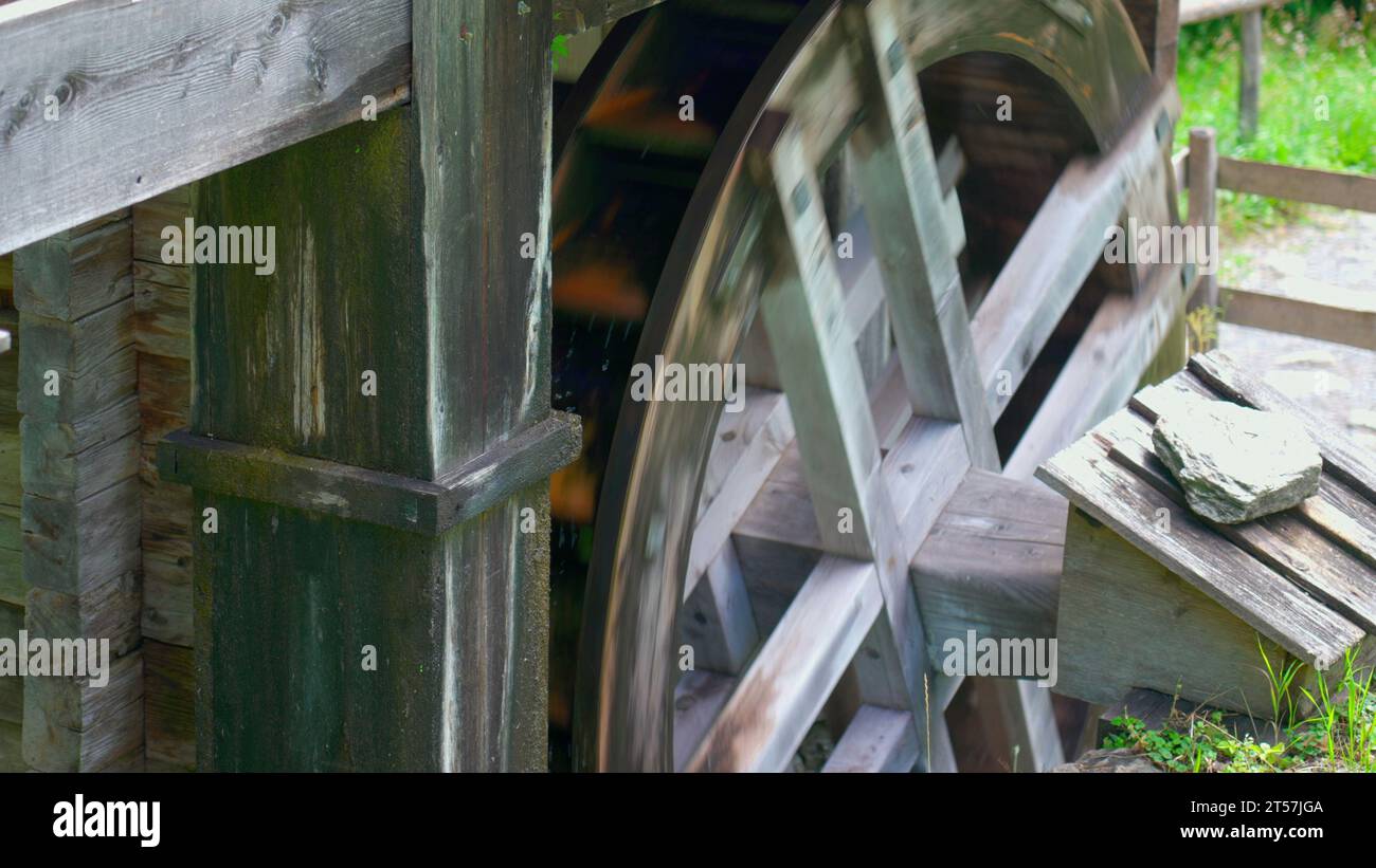 Traditional water wheel in movement in the mill, functional wooden ...