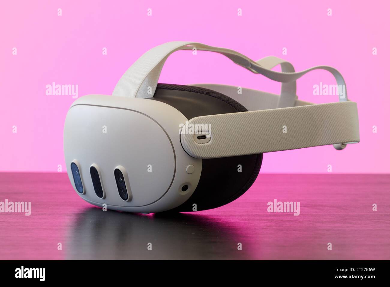 Virtual mixed reality headset, VR glasses on desk. Purple background ...