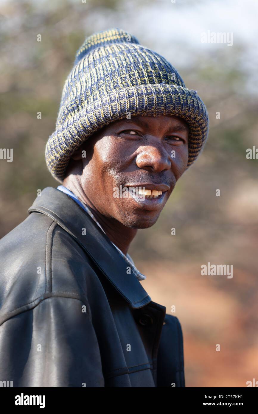 african man with a beanie portrait, village in botswana Stock Photo - Alamy