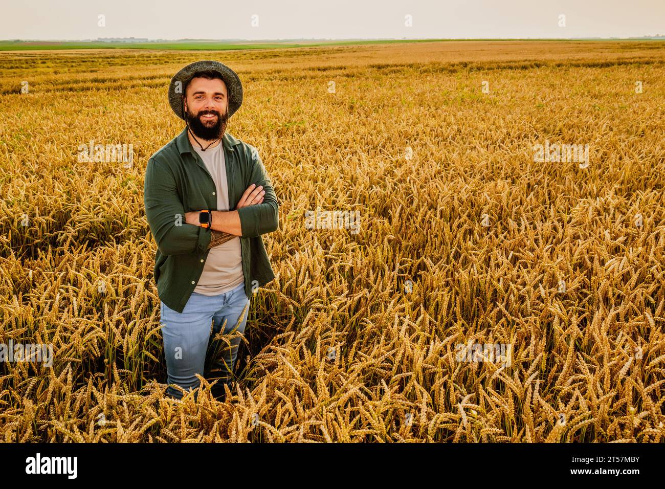 Portrait of farmer who is cultivating wheat. He is satisfied with good ...