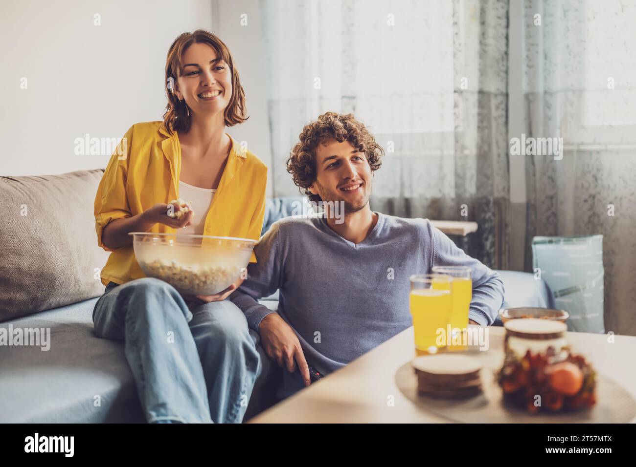 Portrait cheerful man watching tv hi-res stock photography and images ...