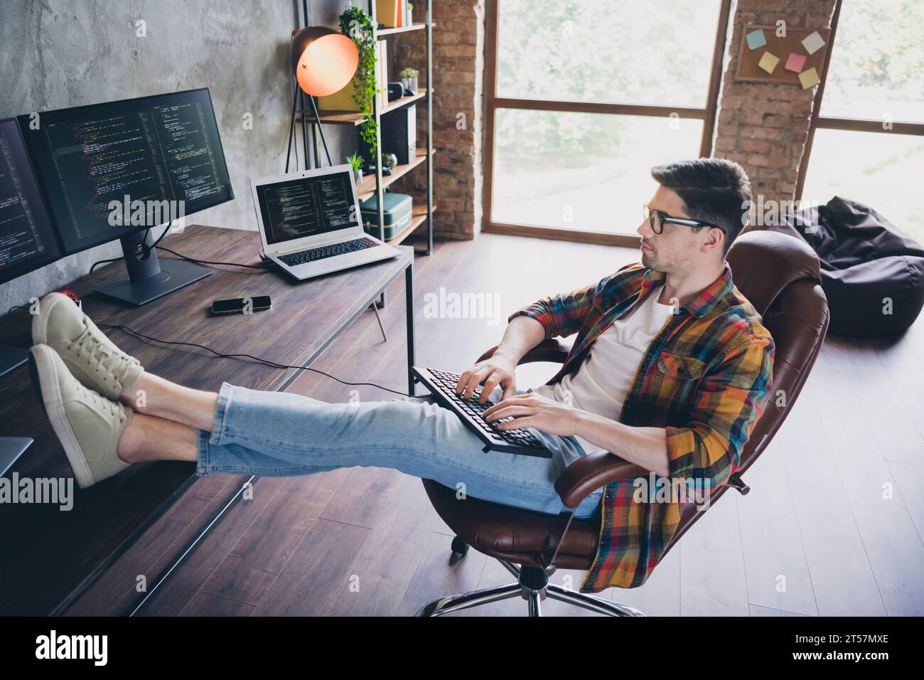 Full length profile photo of skilled front end developer sit chair legs ... Full length profile photo of skilled front end developer sit chair legs ...