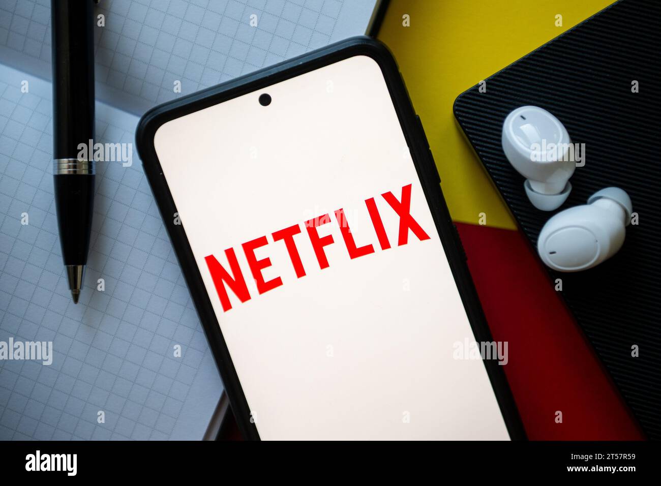In this photo illustration a Netflix logo seen displayed on a ...