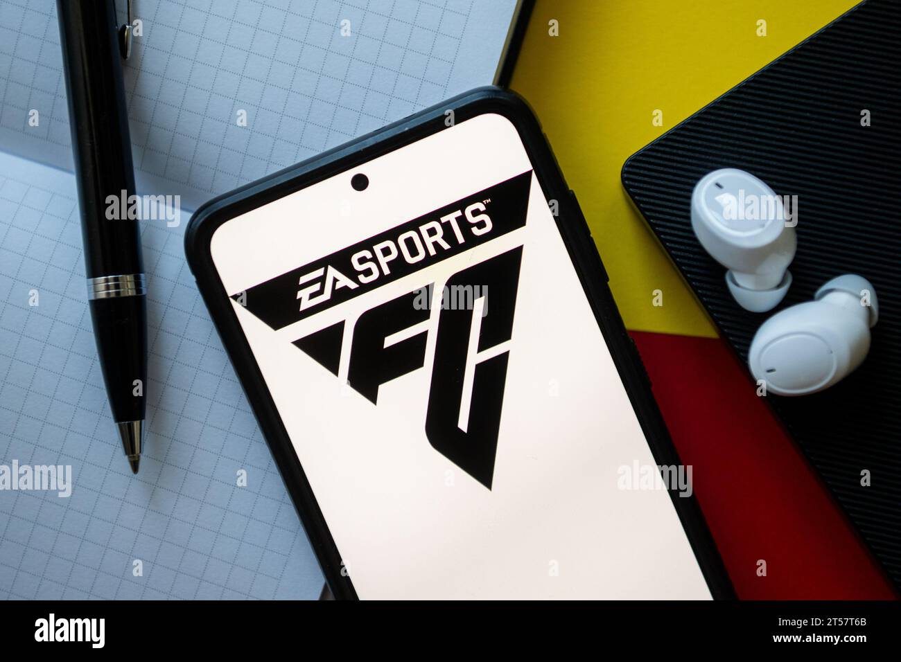 In this photo illustration an EA Sports FC logo seen displayed on a ...