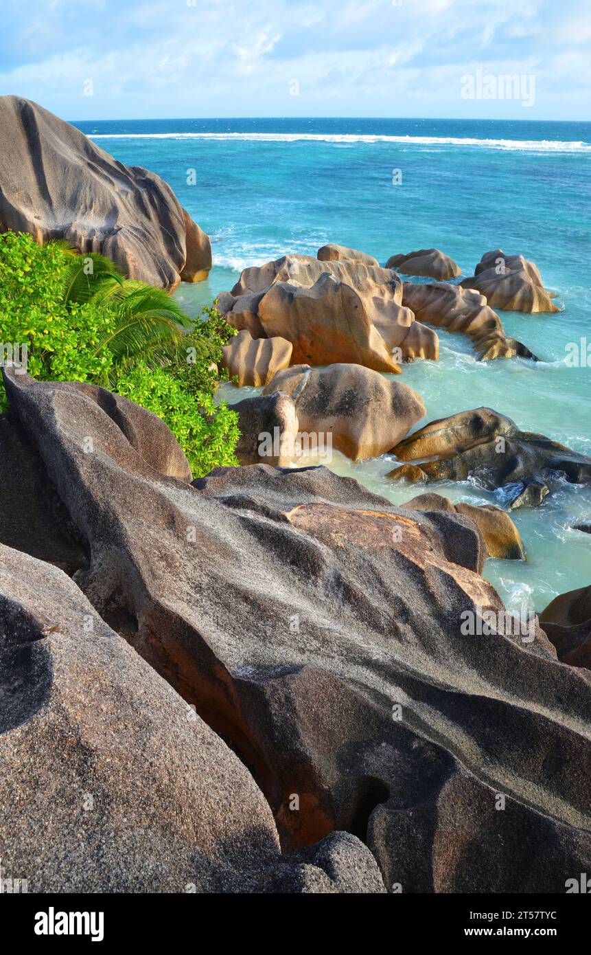 Anse Source d'Argent beach with big granite rocks in sunny day. La ...