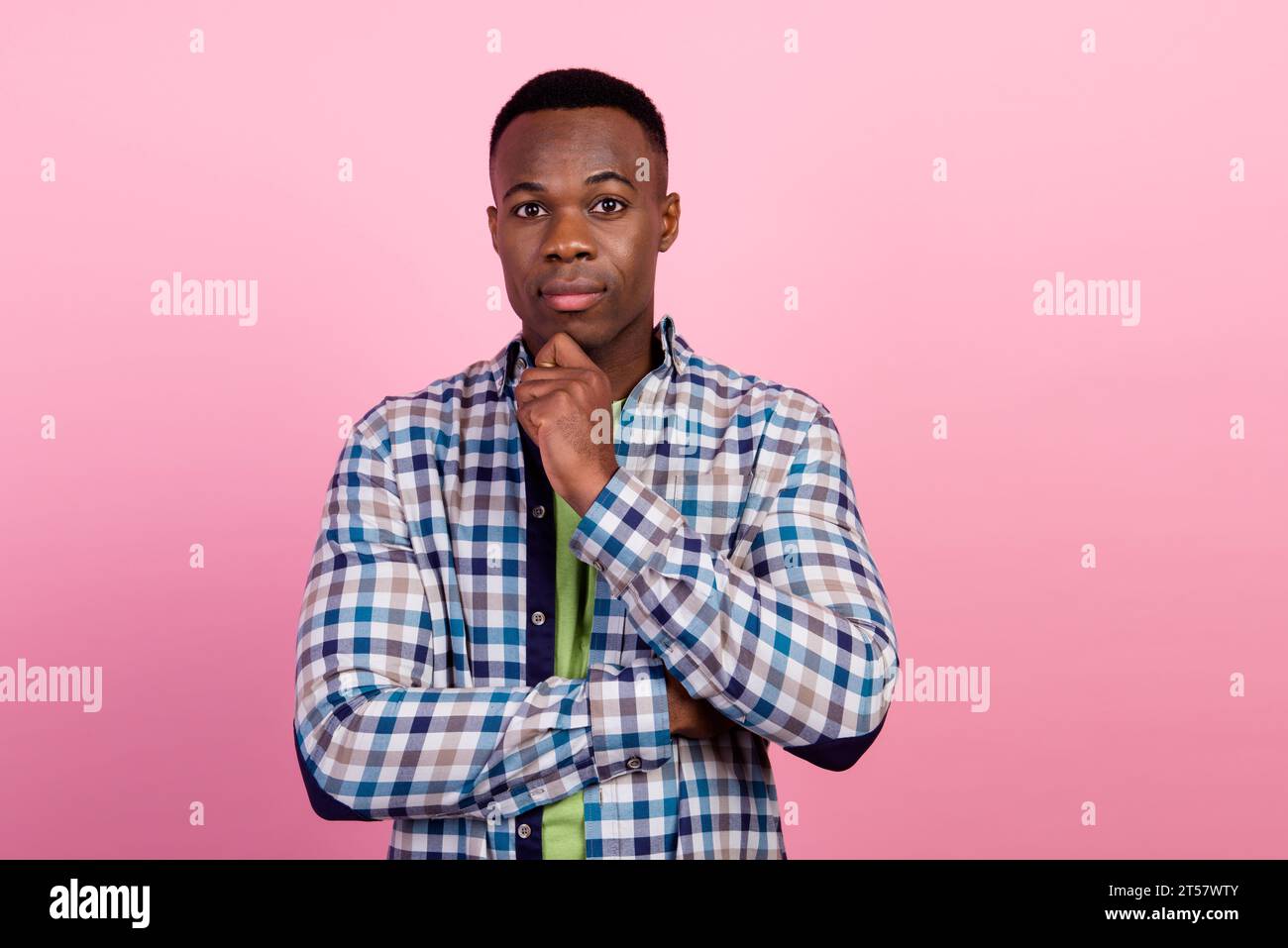 Photo of handsome young businessman touch chin looks serious face ...