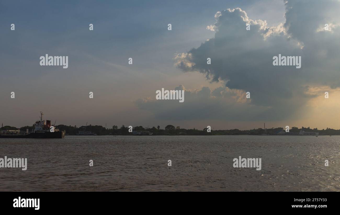 Yangon, Myanmar, 2014. Ominous clouds above the Yangon River at the end ...