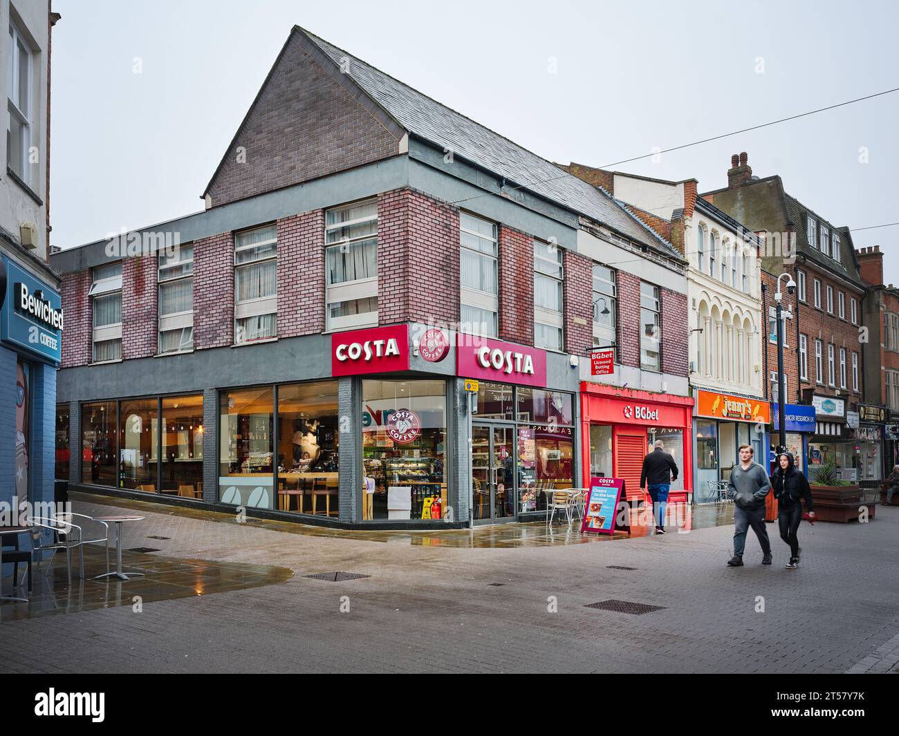Shoppers walk past the Costa coffee shop in the shopping centre of ...