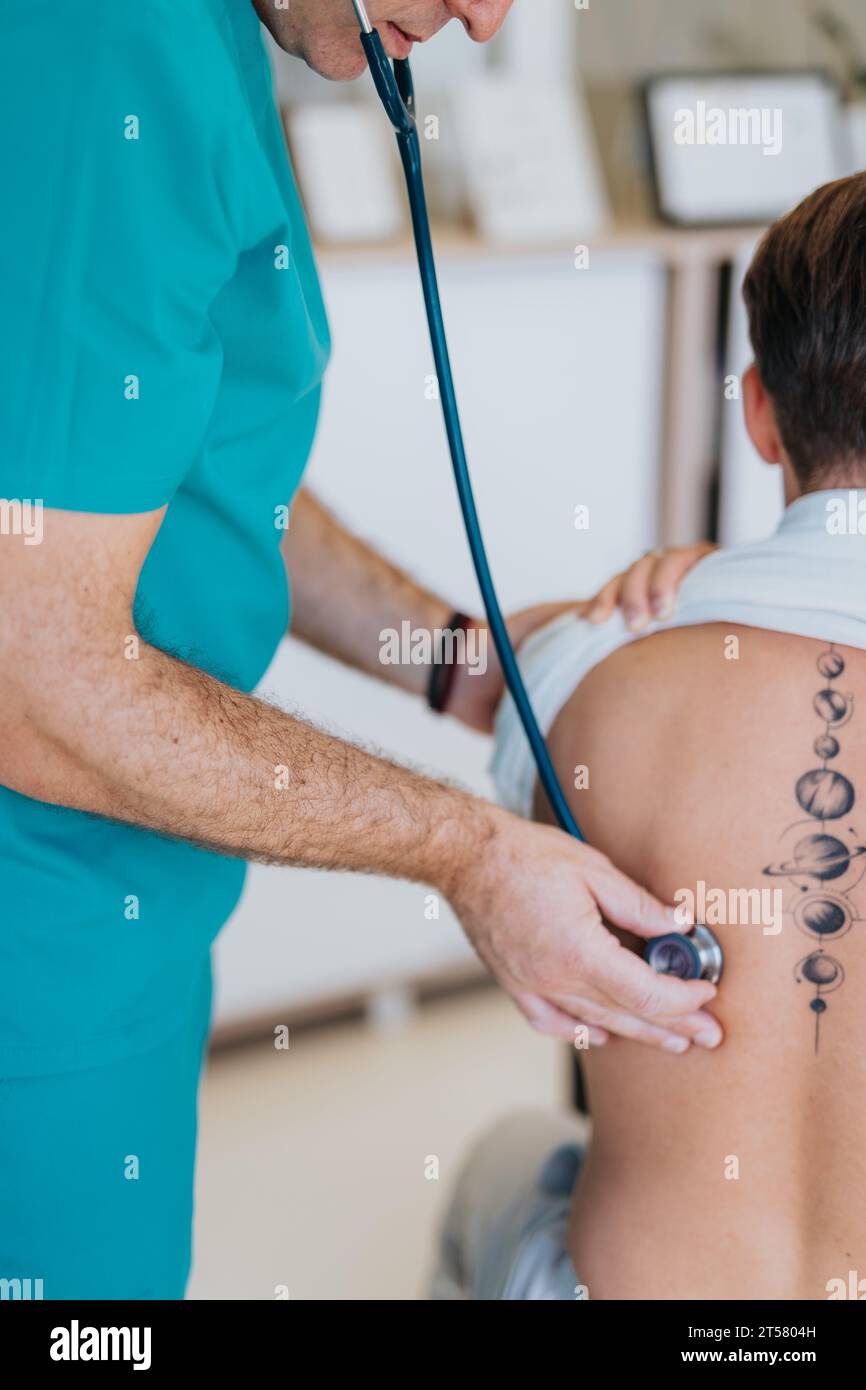 Doctor checking client breath using stethoscope, close up shot Stock ...