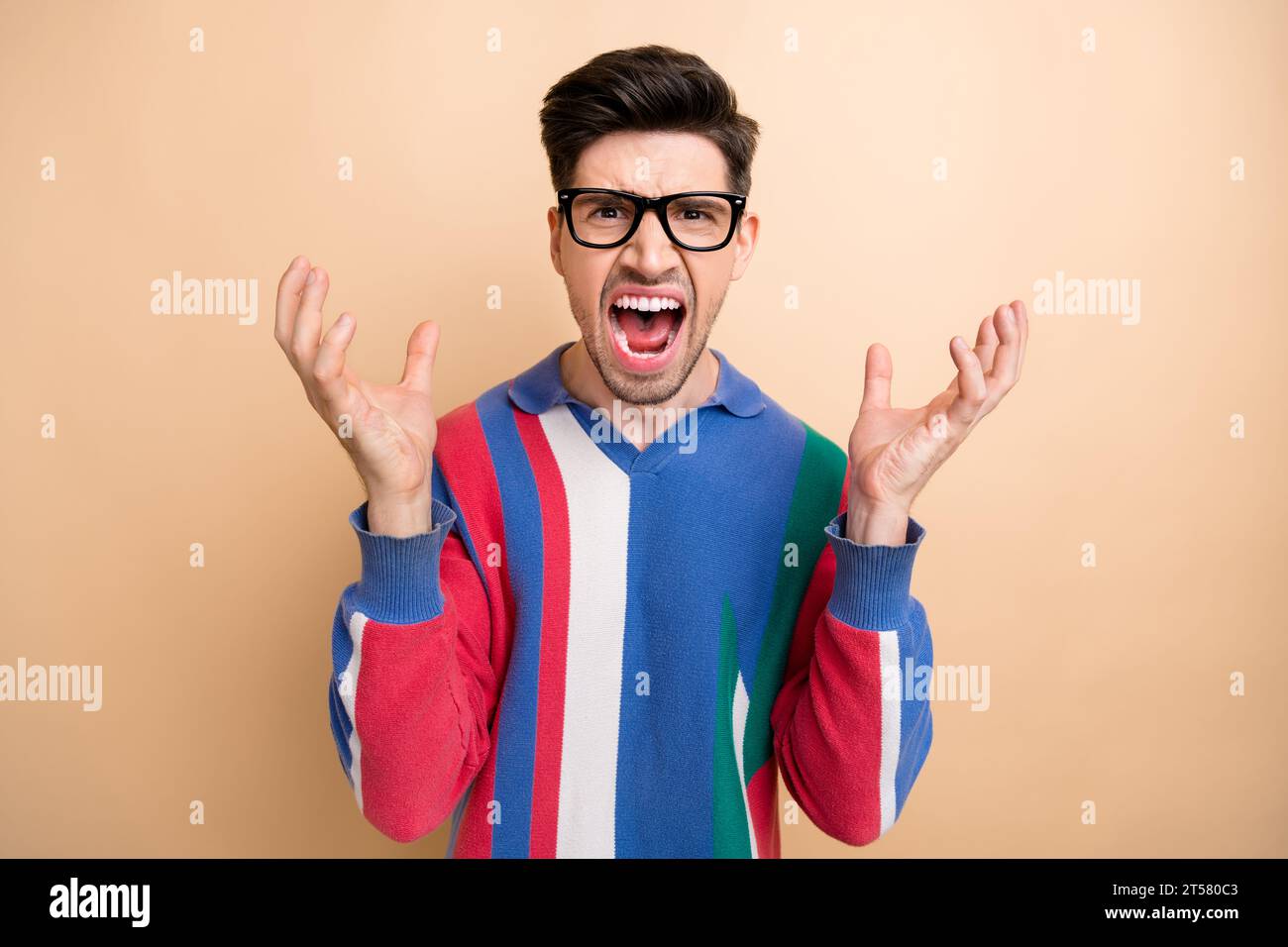 Photo of young angry caucasian funny guy raised hands up screaming ...