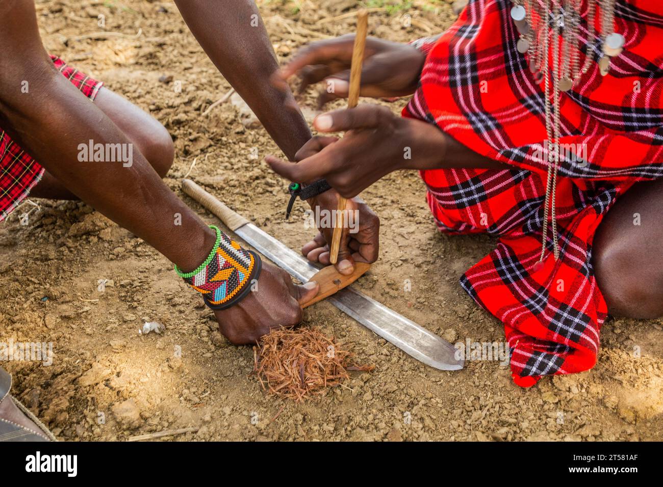 Detail of Masai men making a fire, Kenya Stock Photo - Alamy