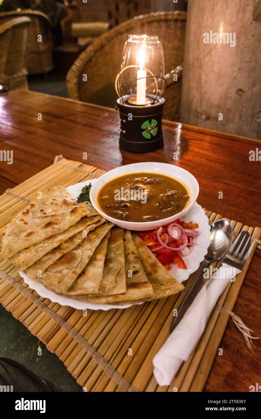 Meal in Kenya - beef stew with chapati Stock Photo - Alamy