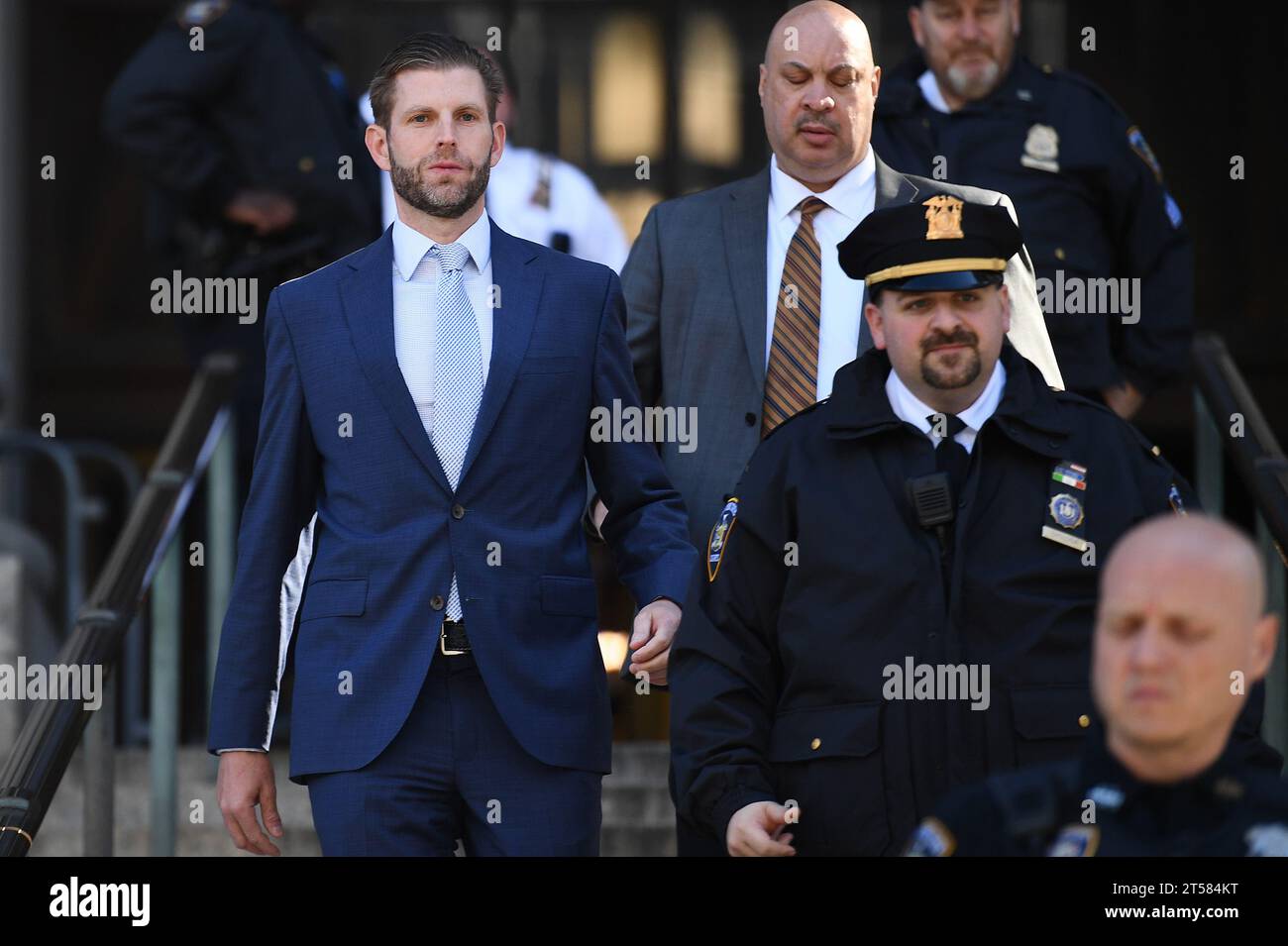 New York, USA. 03rd Nov, 2023. Eric Trump (blue suit) seen leaving ...