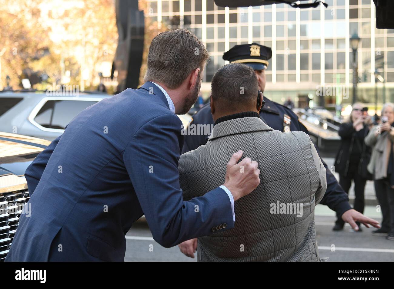 New York, USA. 03rd Nov, 2023. Eric Trump (l) takes a selfie with ...