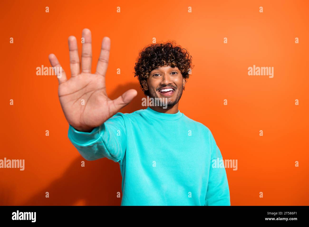 Close up photo of young funny friendly guy showing high five sign ...
