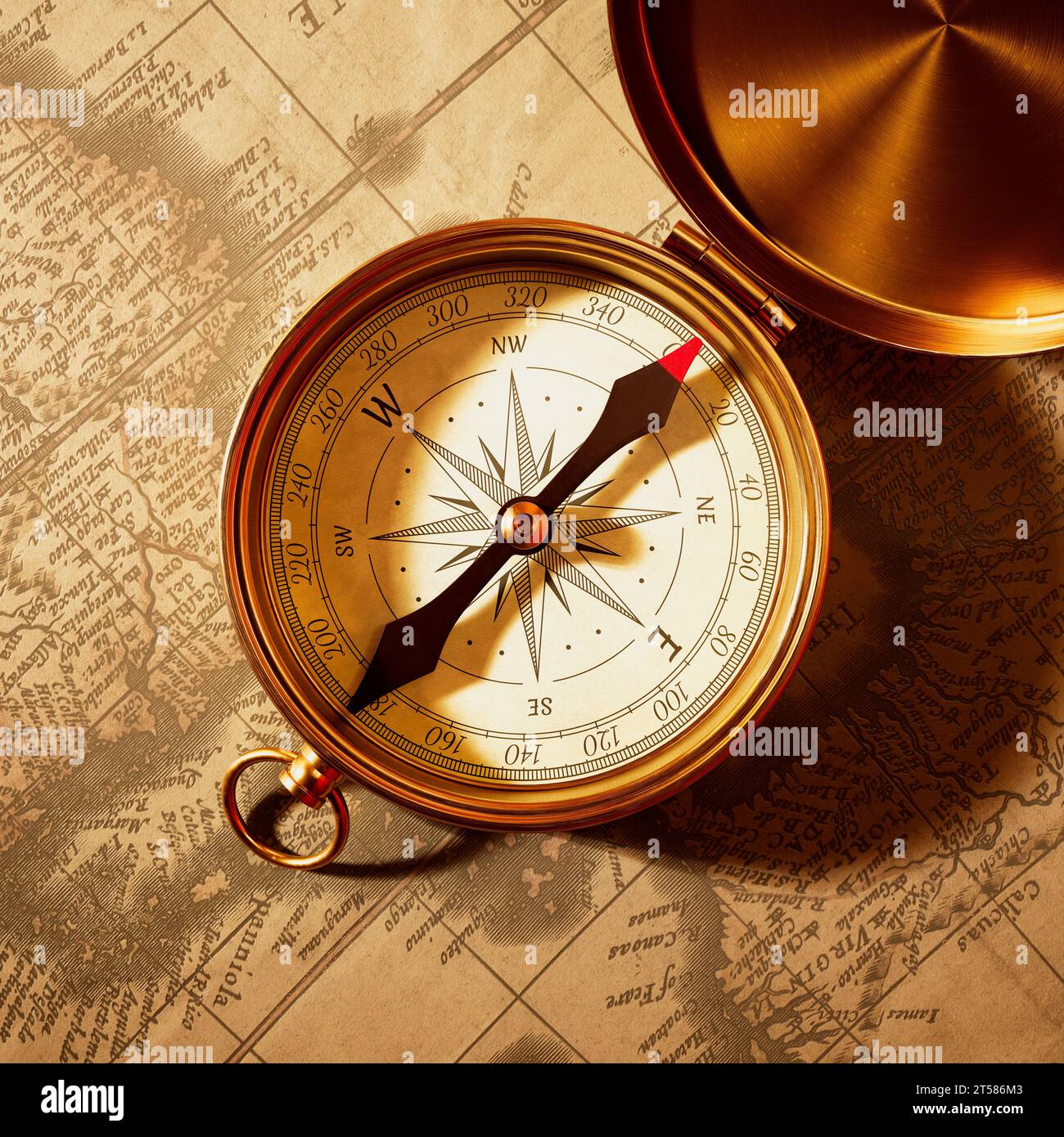 close-up view of a vintage gold compass lying on an old, weathered map ...