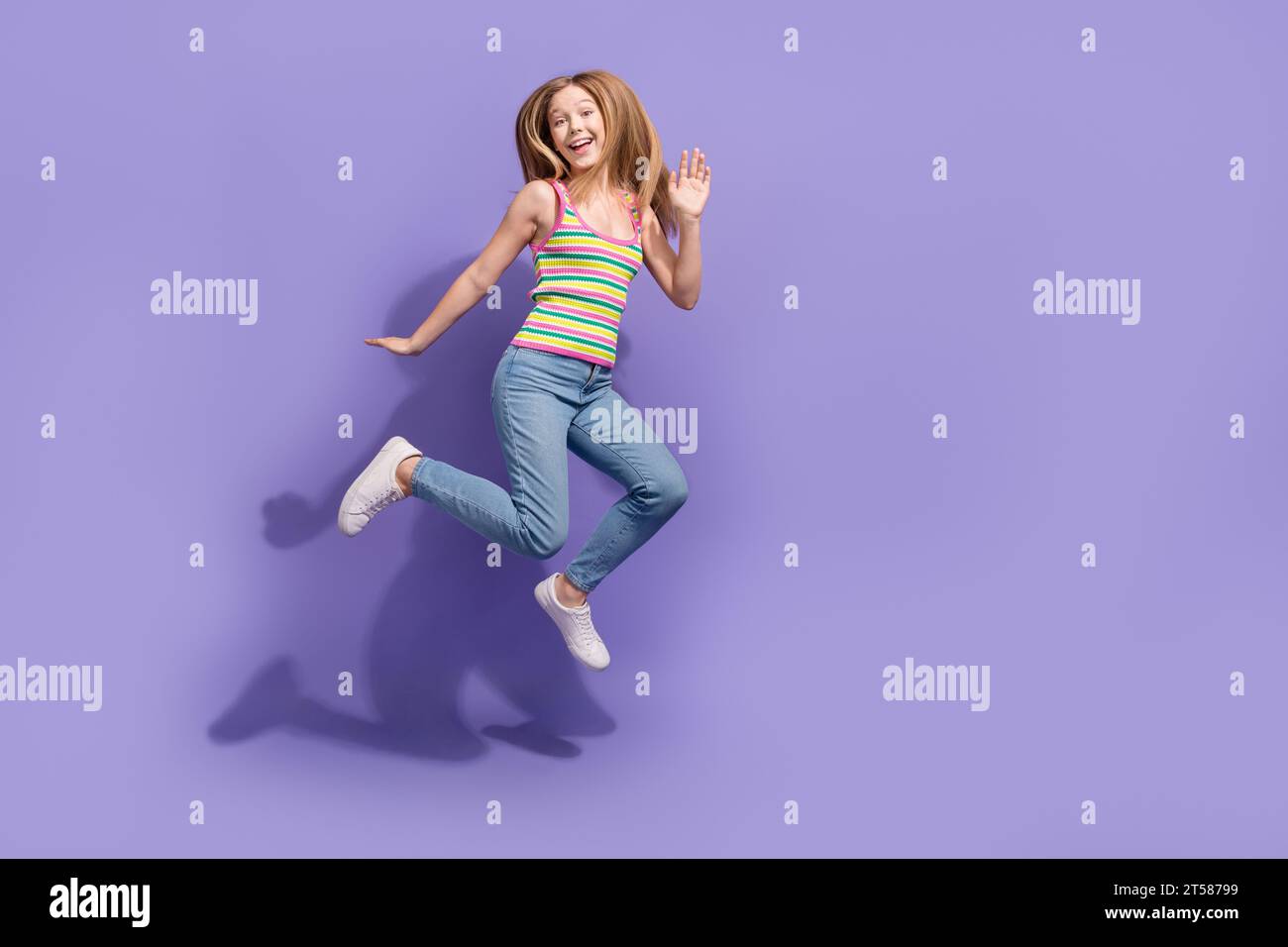 Full length photo of lovely teen blonde lady jump wave hand hi dressed ...