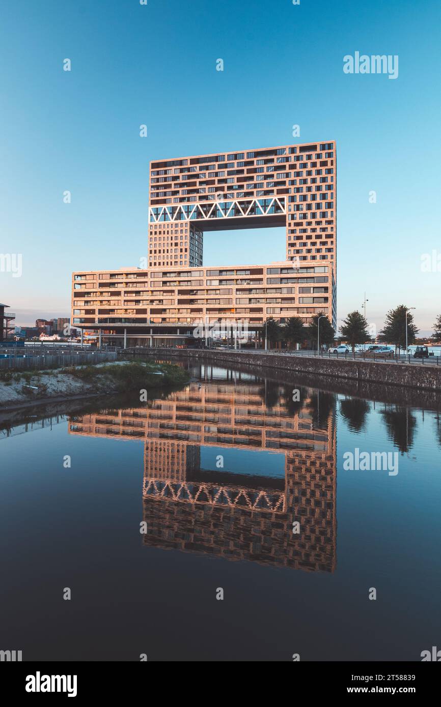 Chair-shaped skyscraper in the harbour of Amsterdam, Netherlands during ...