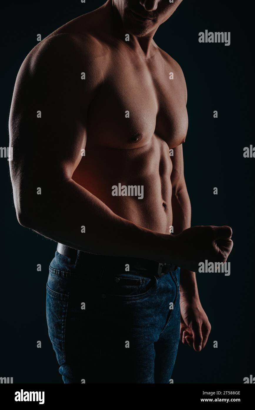 Good-looking and muscular man flexing his bicep Stock Photo - Alamy