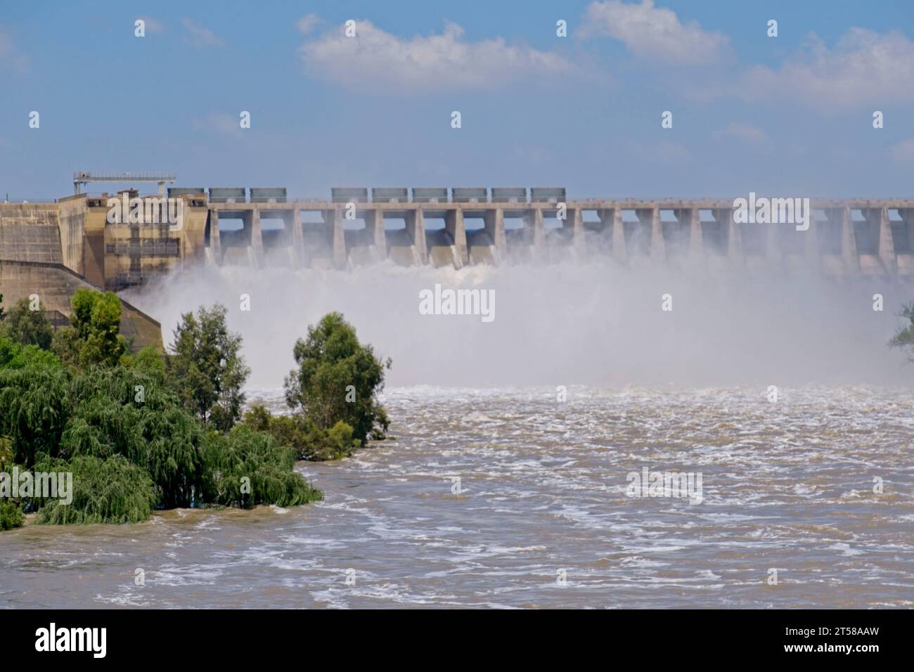 Vaal dam wall with mist from water gushing out of open sluices Stock ...