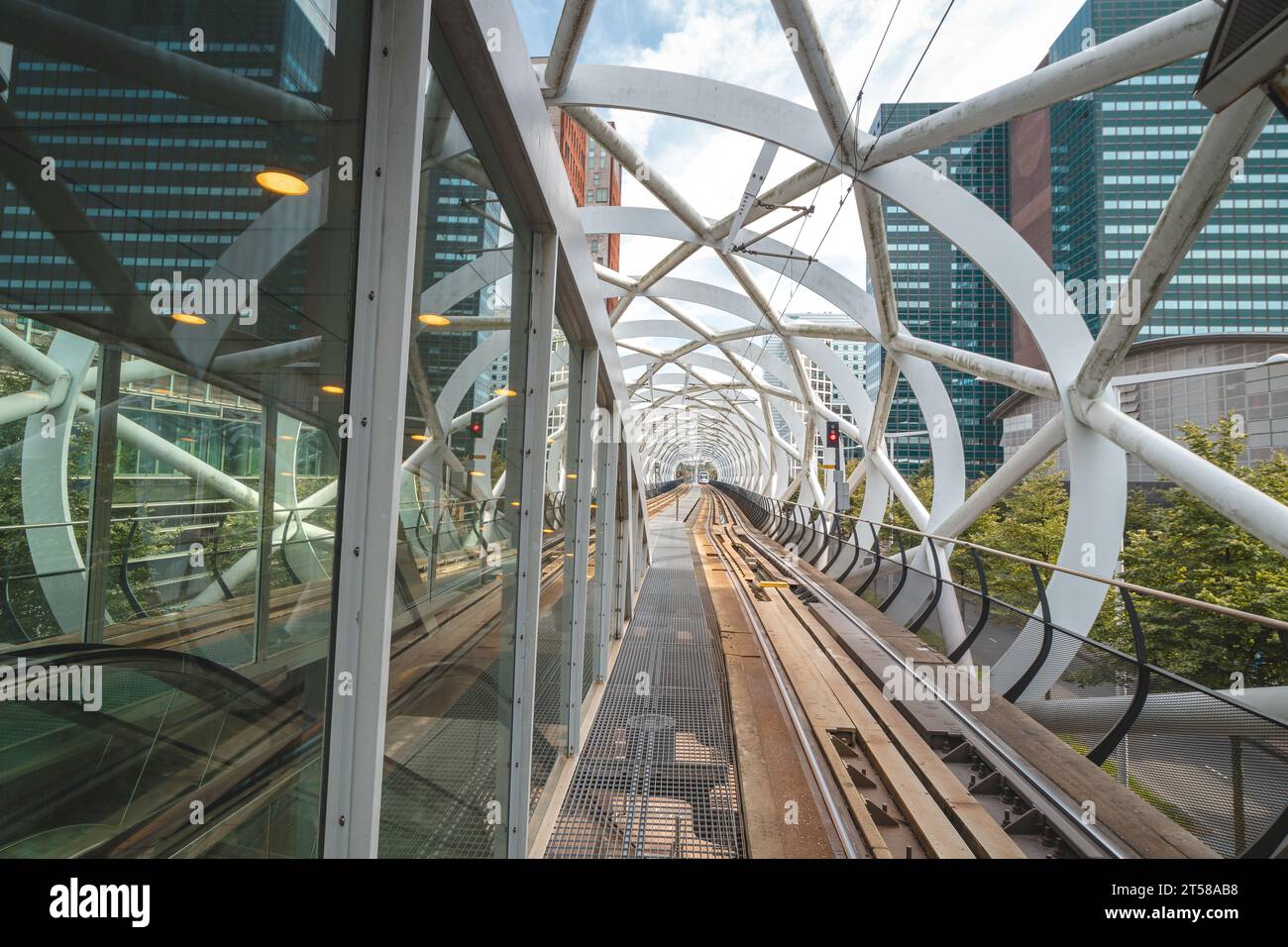Modern tram station in Den Haag. A tunnel made of white pillars that ...