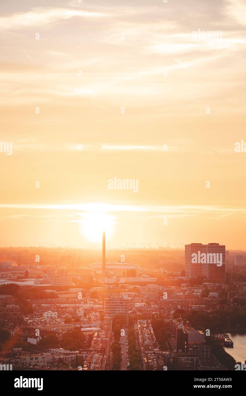 Sun setting over the horizon in Rotterdam. Red light irradiation of the ...