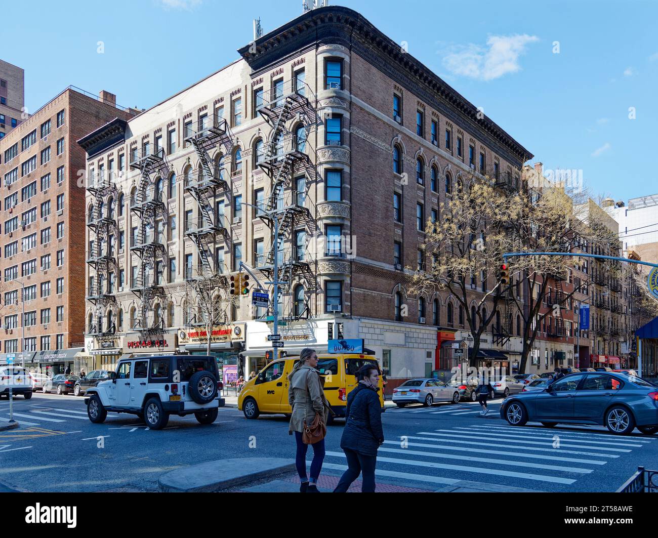Ornate terra cotta spandrels punctuate the turreted corner of 252 East ...
