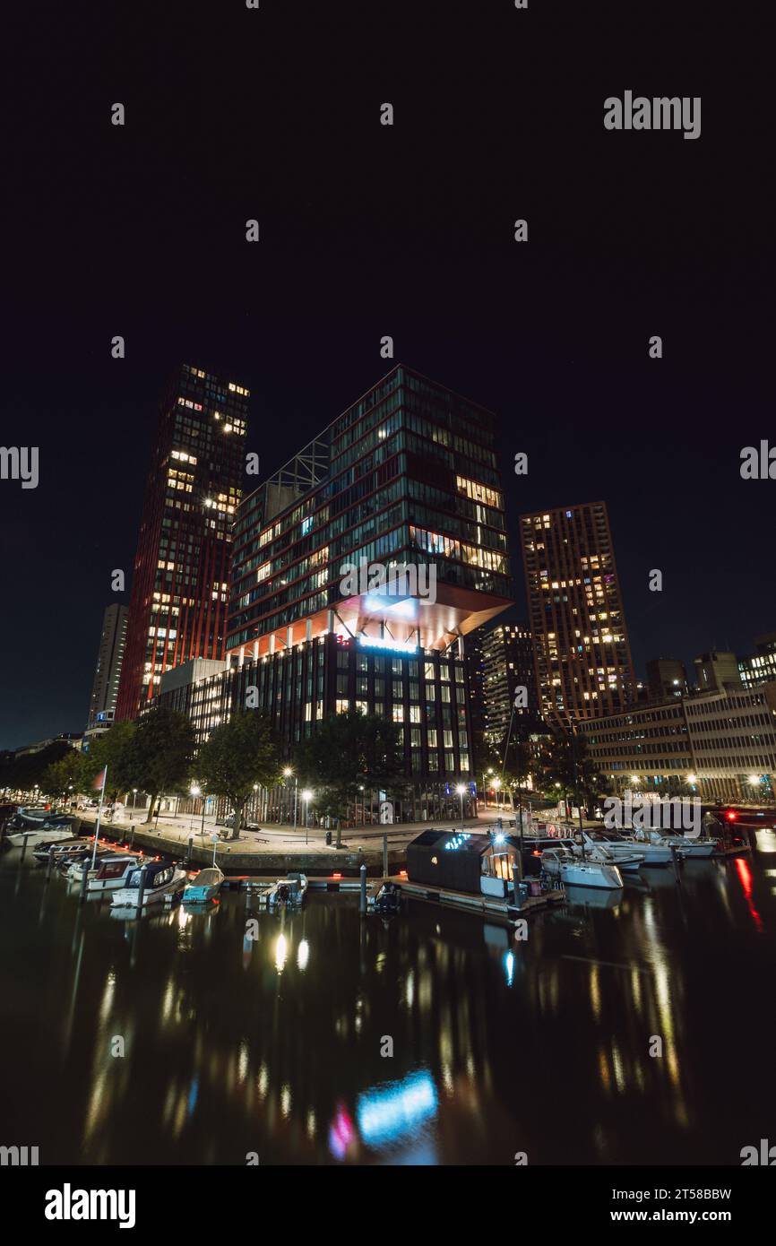 Unique skyscraper in the harbour of Rotterdam during the night with ...