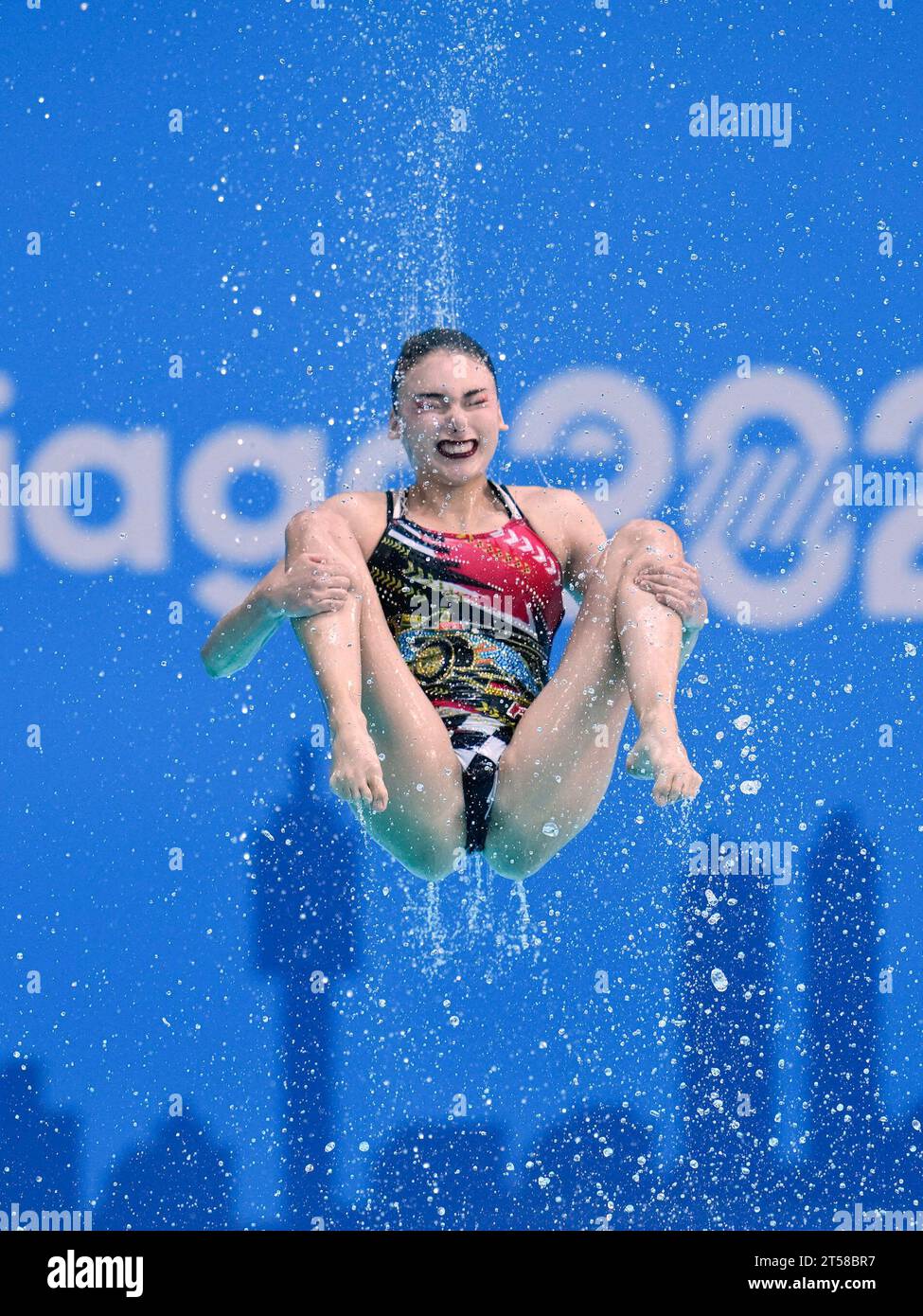 A member of Chile's team performs in the artistic swimming acrobatic ...