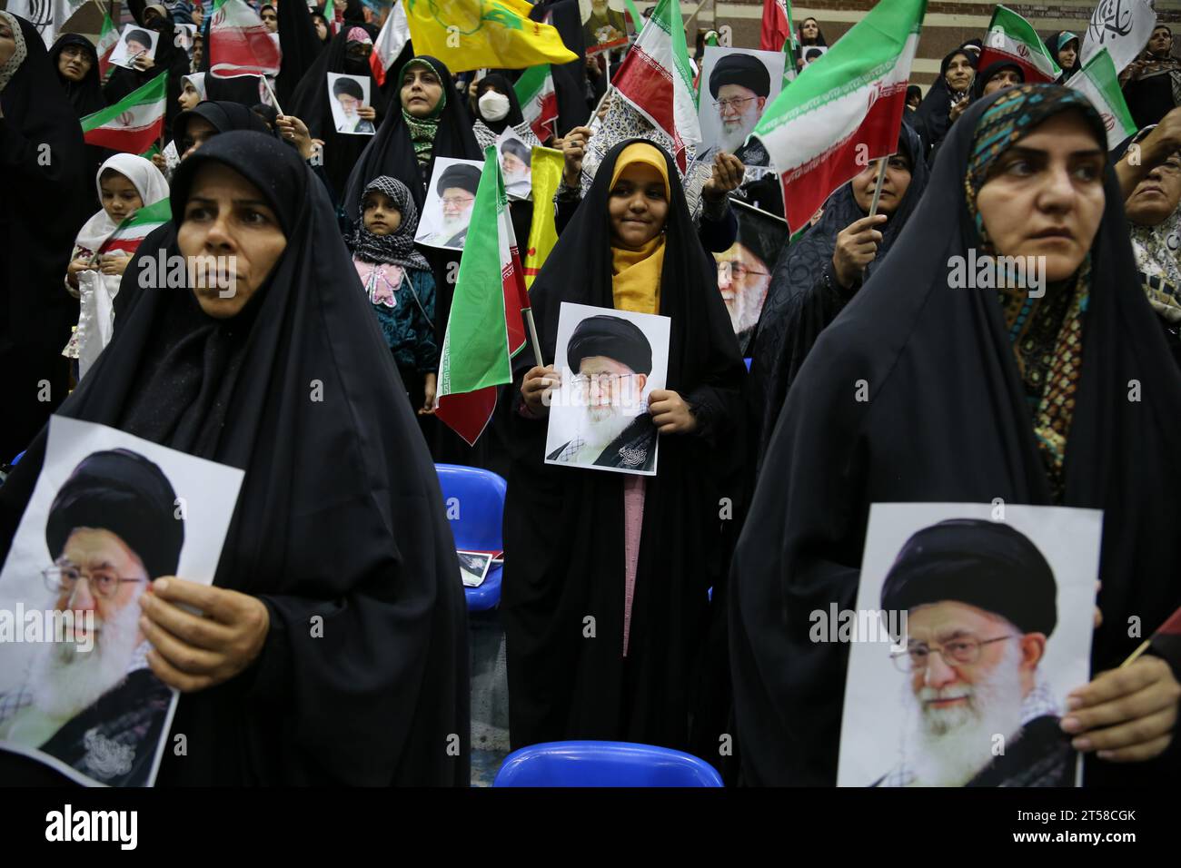 Tehran, Iran. 2nd Nov, 2023. Iranian veiled women hold portraits of ...